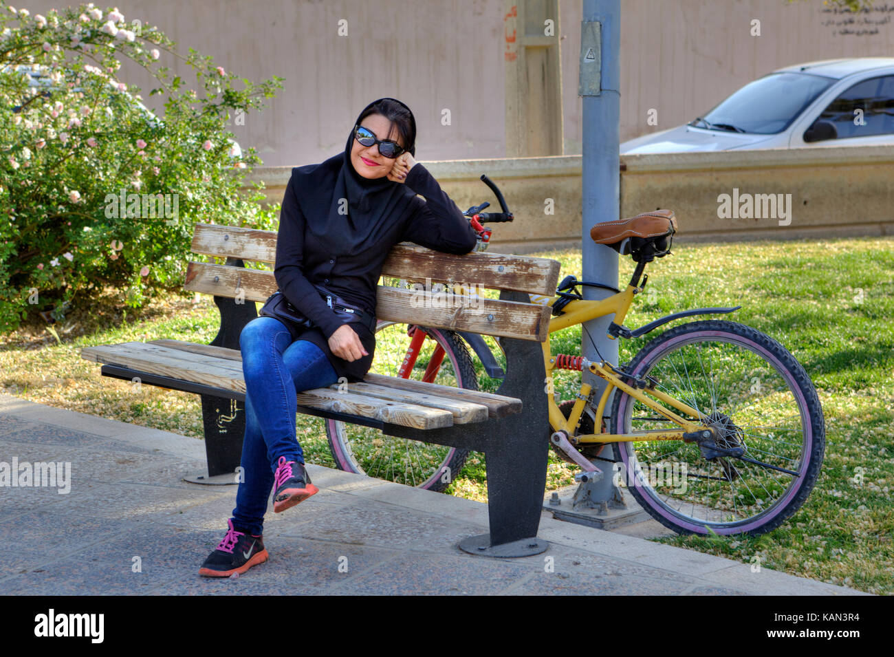 Muslim women sitting on bench hi-res stock photography and images - Alamy