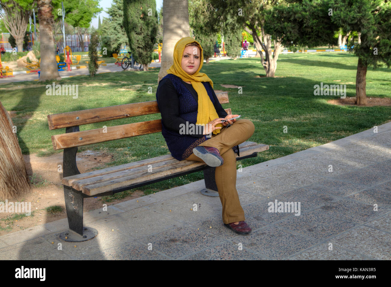 Muslim women sitting on bench hi-res stock photography and images - Alamy