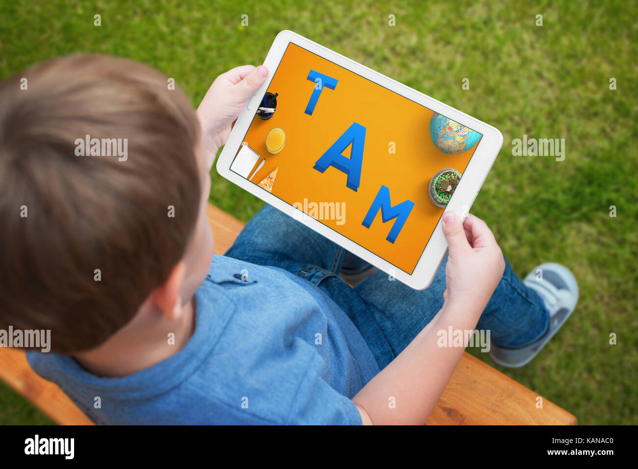 Child uses a tablet to learn letters. A creative app for playing and ...