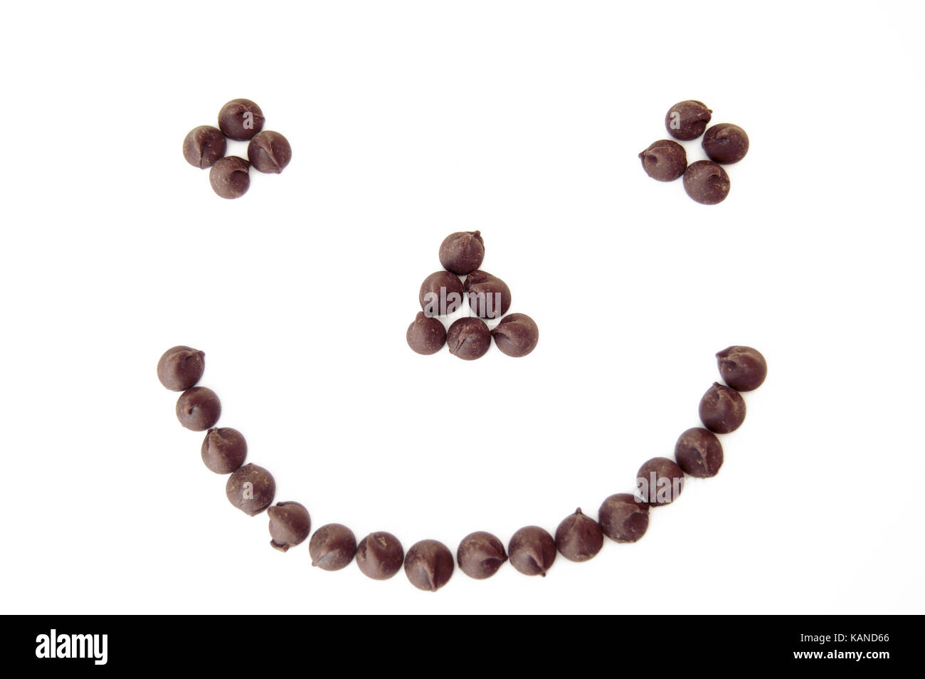 A smiling chocolate chip face on a white background Stock Photo - Alamy