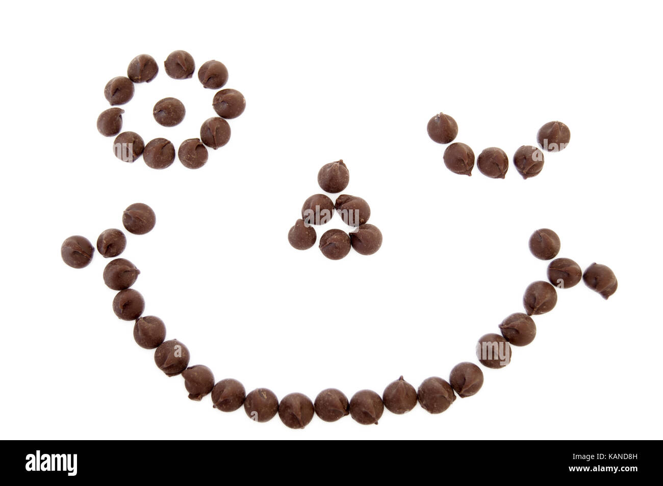A smiling chocolate chip face on a white background Stock Photo - Alamy