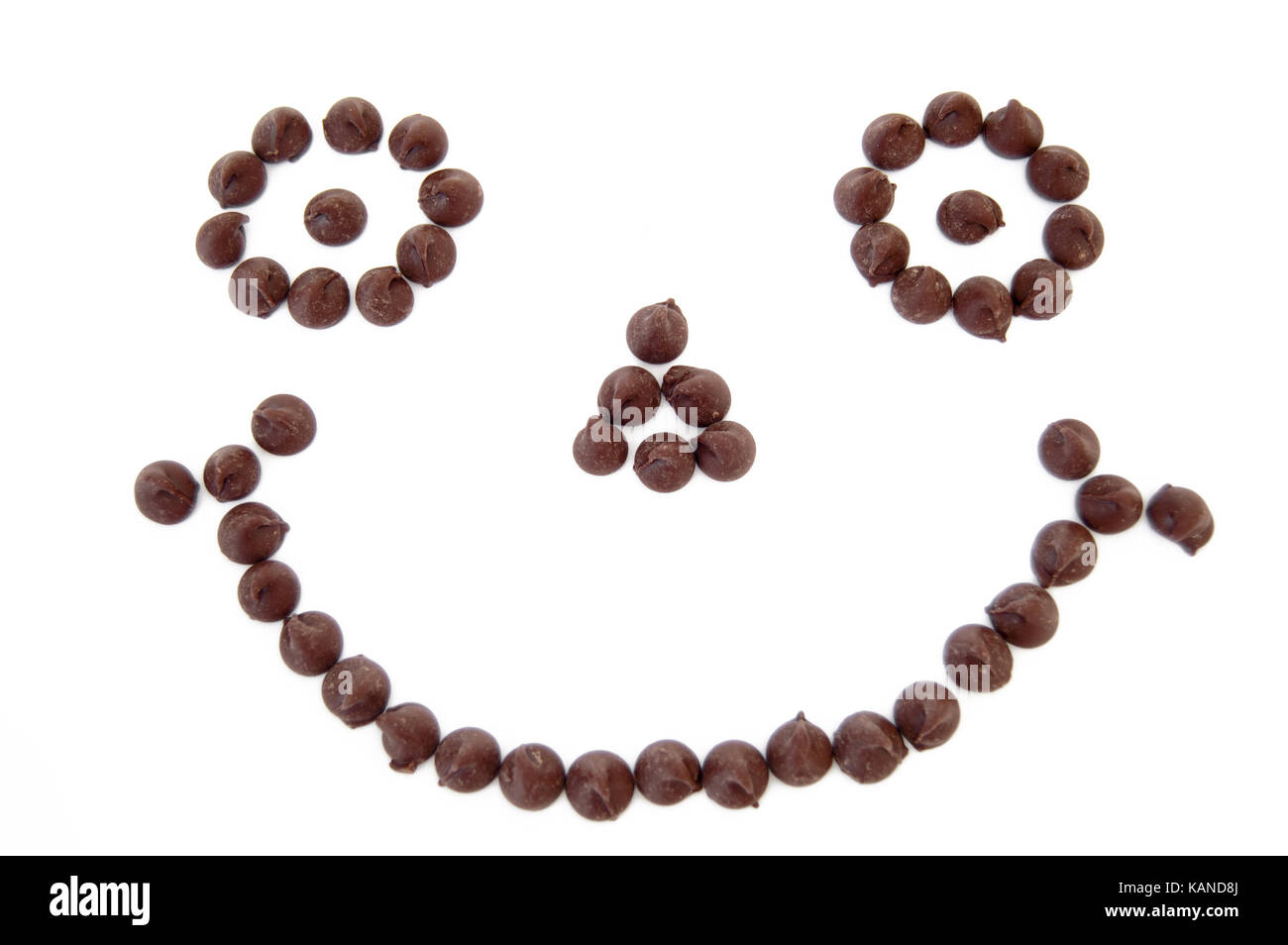 A smiling chocolate chip face on a white background Stock Photo - Alamy