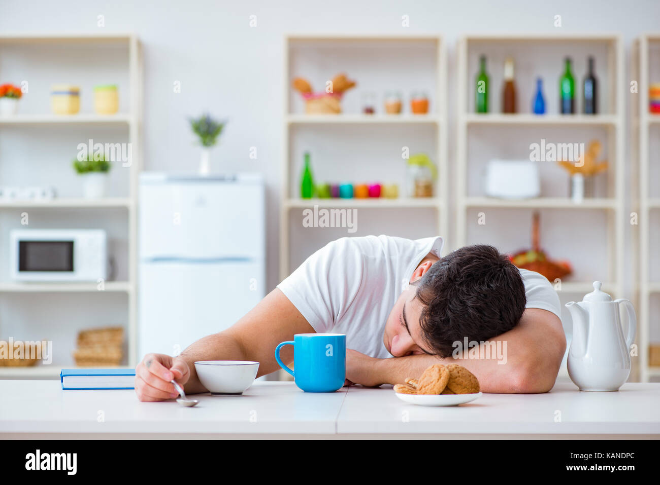 Man falling asleep during his breakfast after overtime work Stock Photo ...
