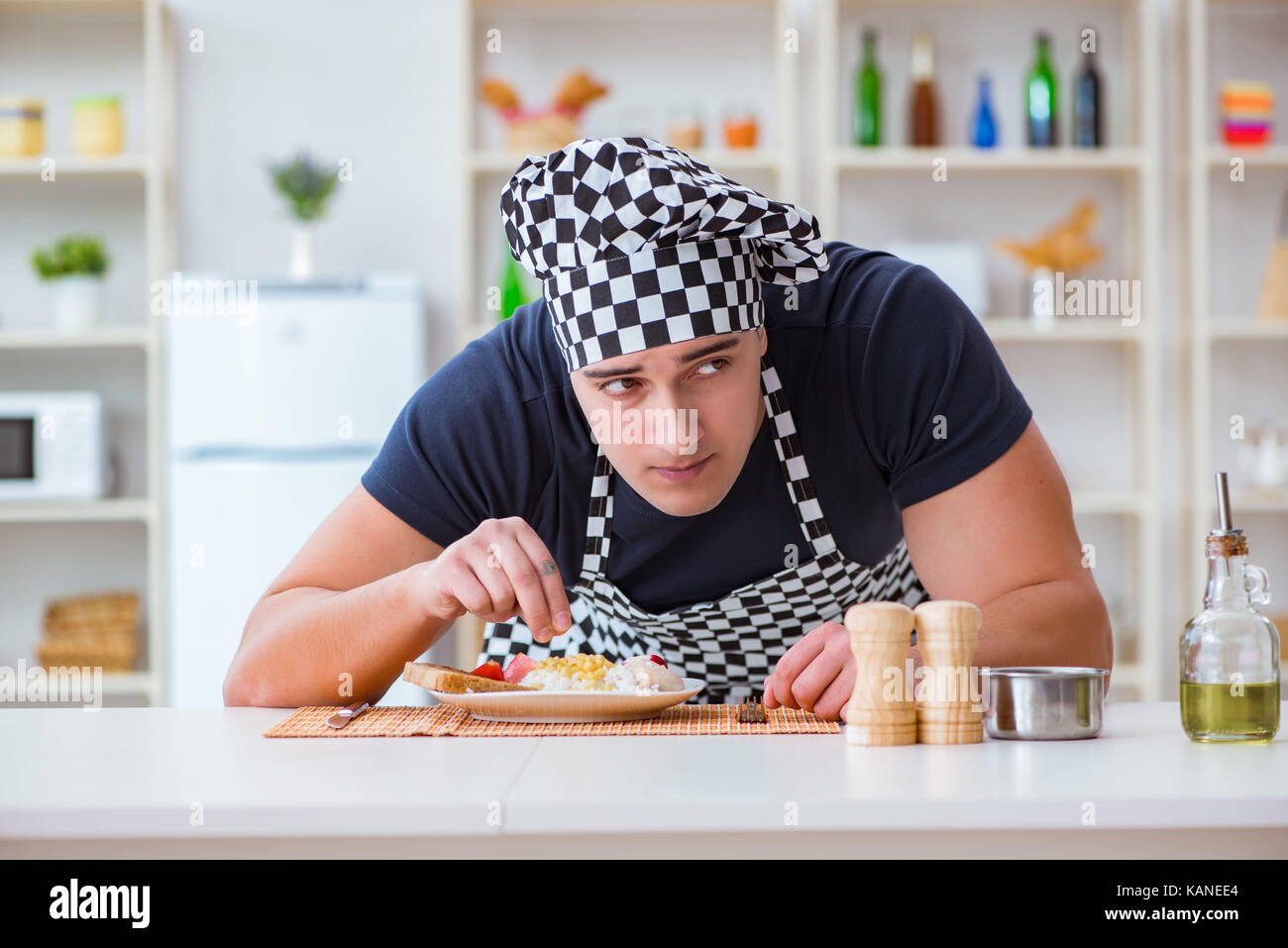 Chef cook cooking a meal breakfast dinner in the kitchen Stock Photo ...