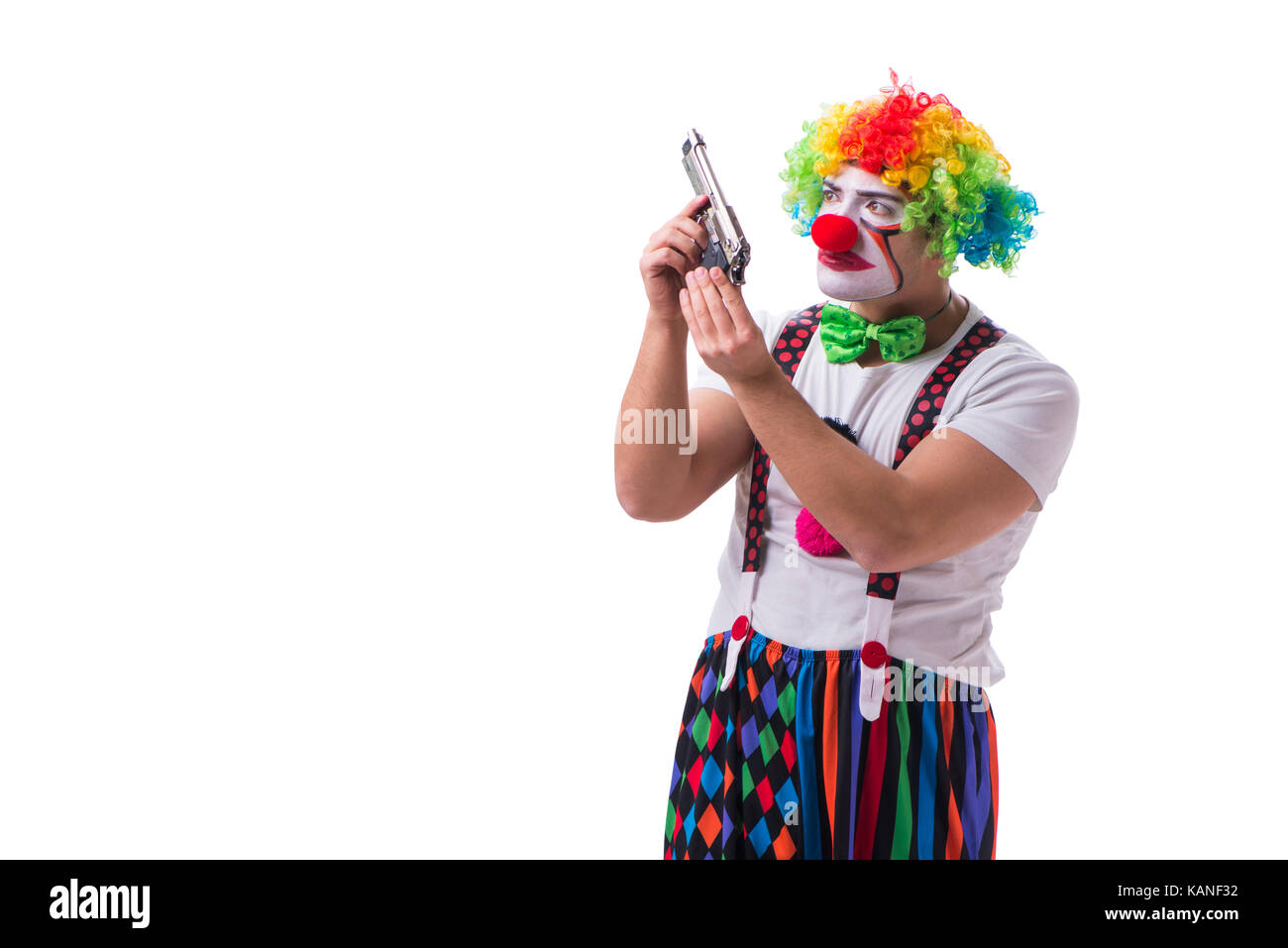 Funny clown with a gun pistol isolated on white background Stock Photo ...