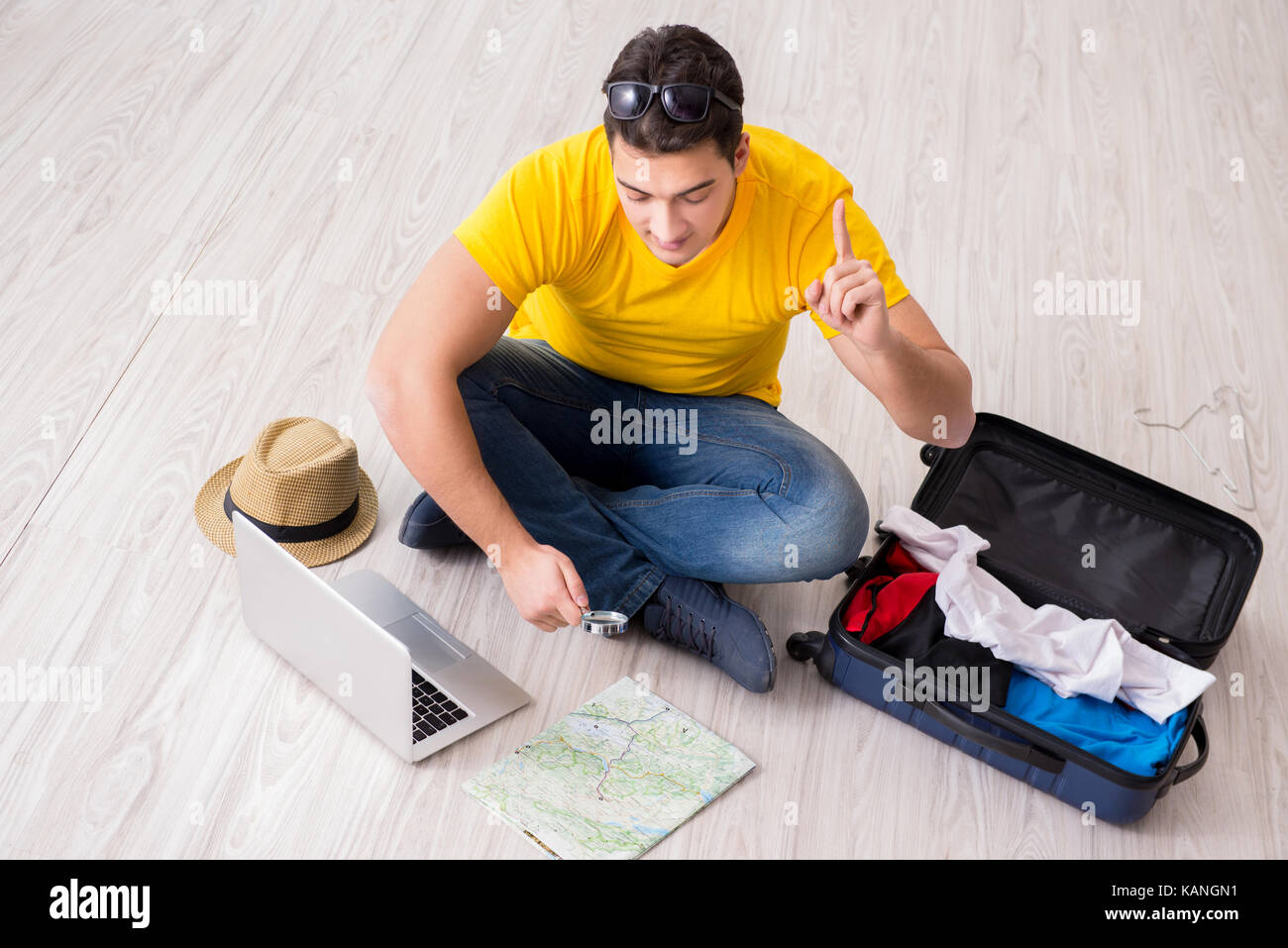 Man planning his vacation trip with map Stock Photo - Alamy