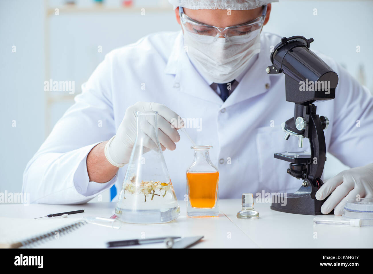 Chemist mixing perfumes in the lab Stock Photo - Alamy