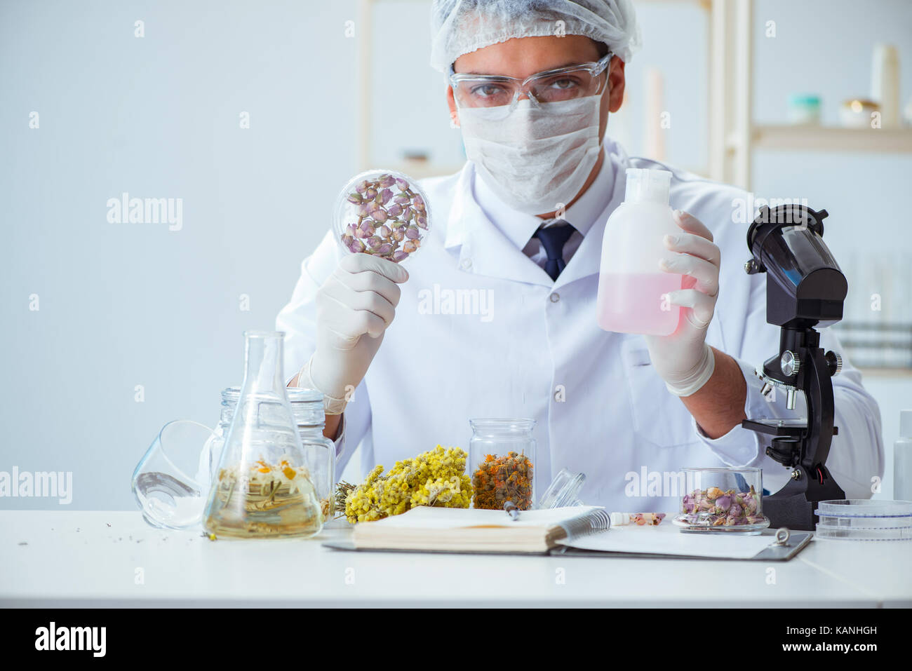Chemist mixing perfumes in the lab Stock Photo - Alamy