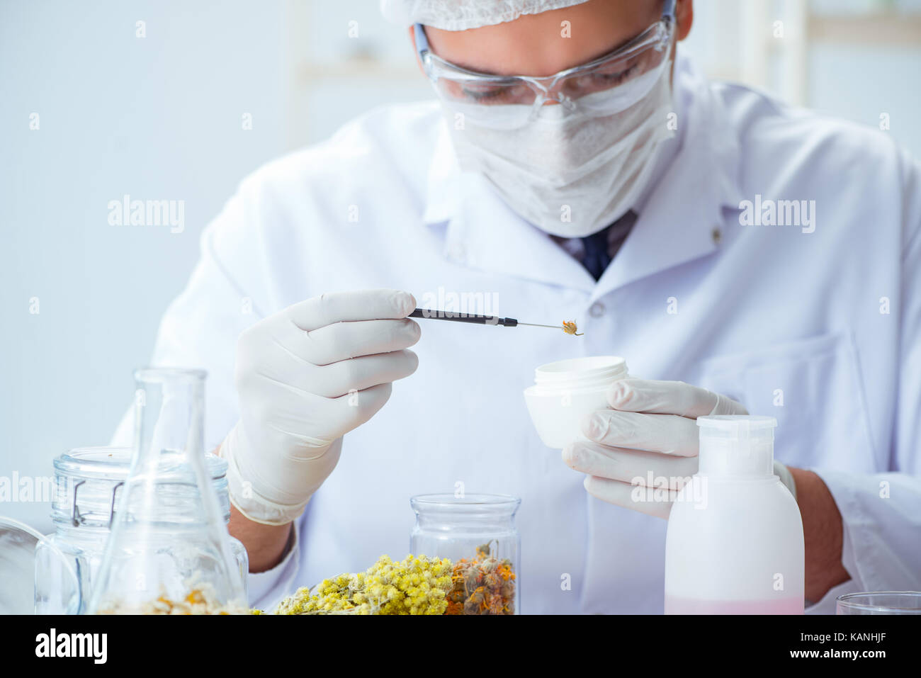 Chemist mixing perfumes in the lab Stock Photo - Alamy