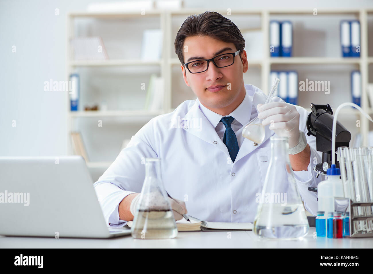 Young researcher scientist doing a water test contamination experiment ...