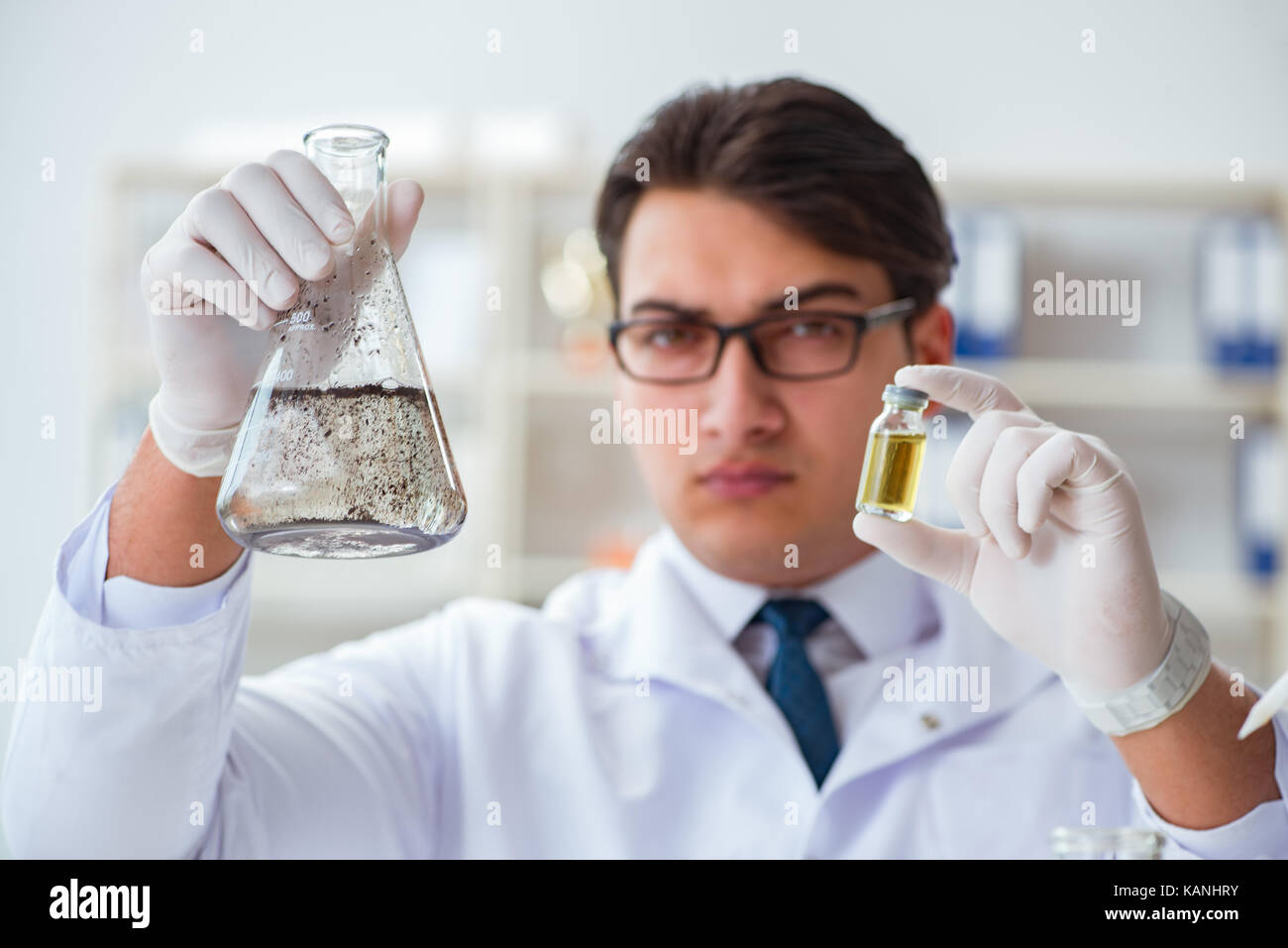 Young researcher scientist doing a water test contamination experiment ...
