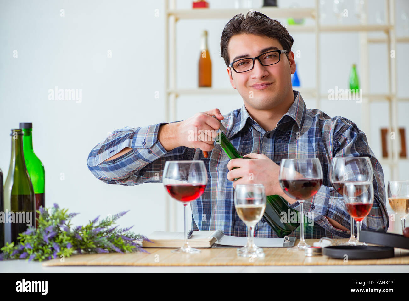 Professional sommelier tasting red wine Stock Photo - Alamy