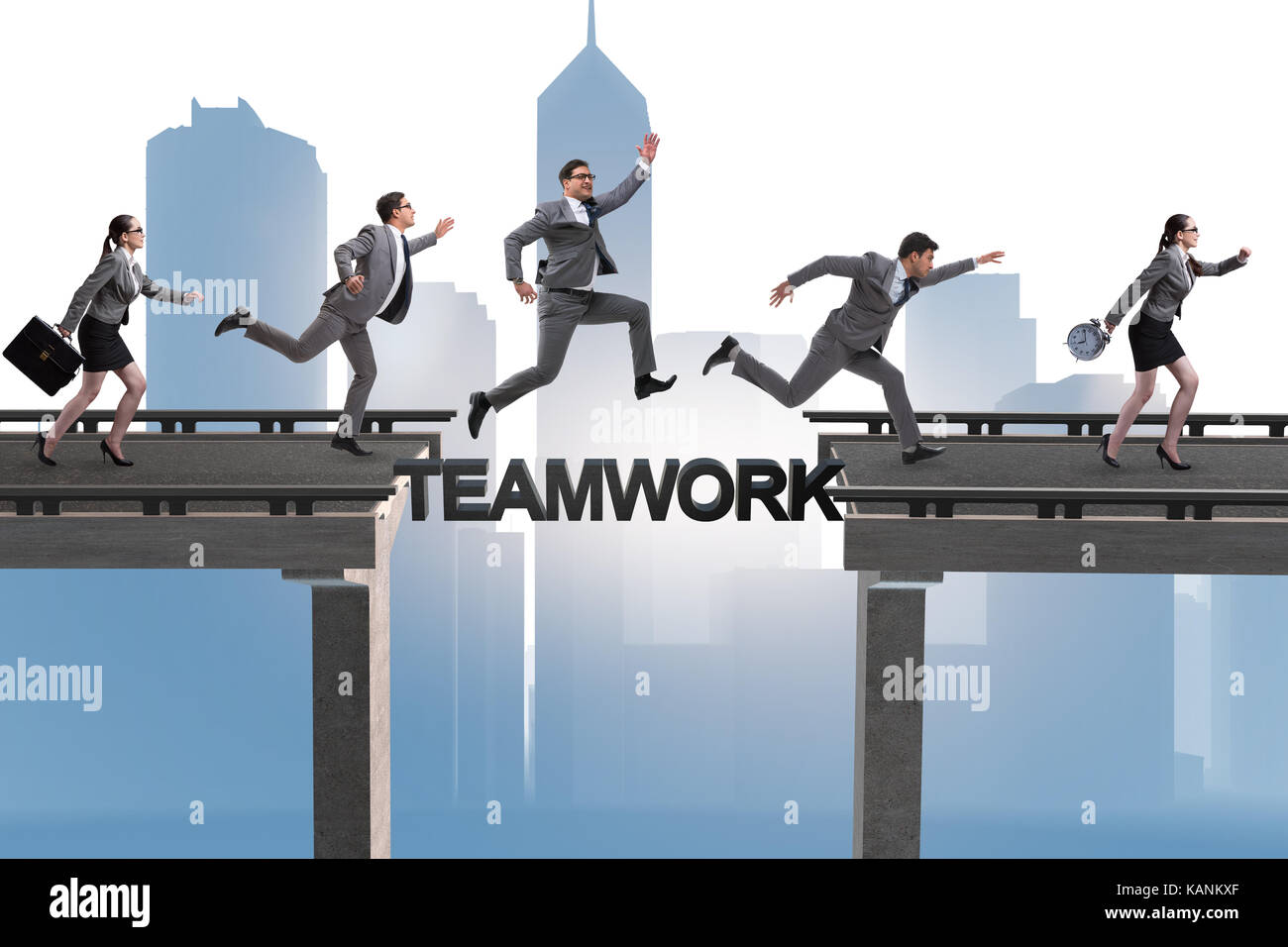 Teamwork concept with business people crossing bridge Stock Photo - Alamy