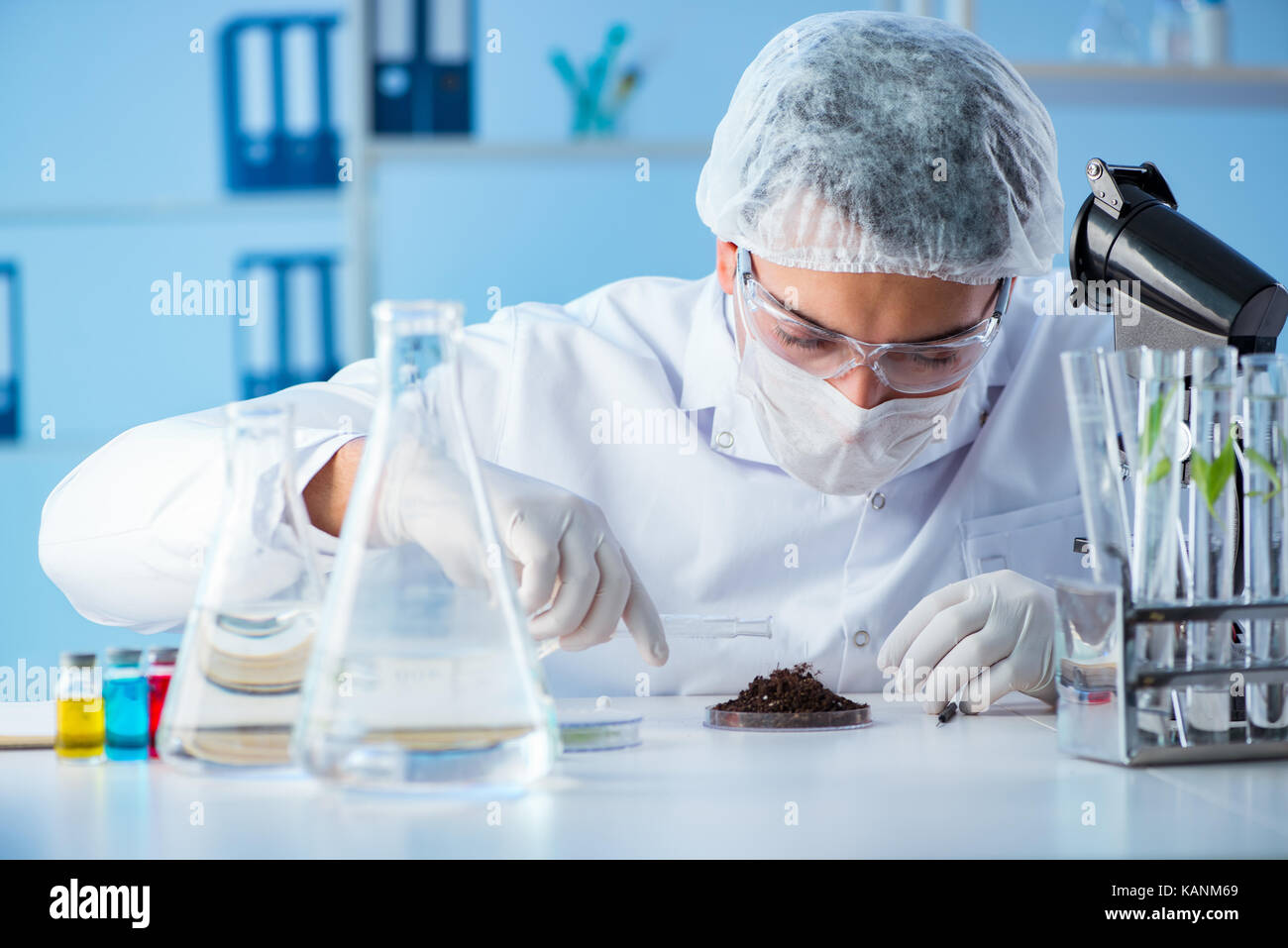 Male scientist researcher doing experiment in a laboratory Stock Photo ...