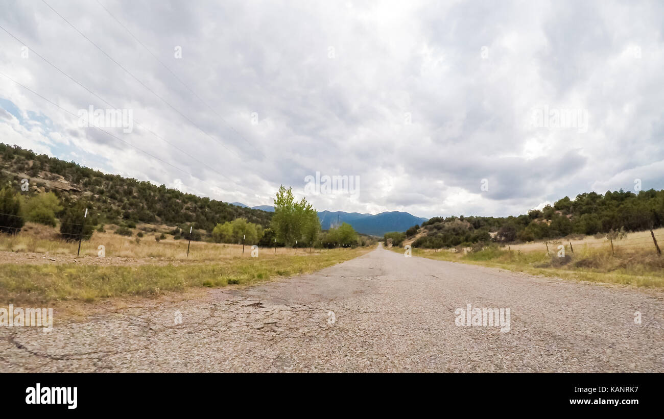 Driving in rural area of Western Colorado on cloudy day Stock Photo - Alamy