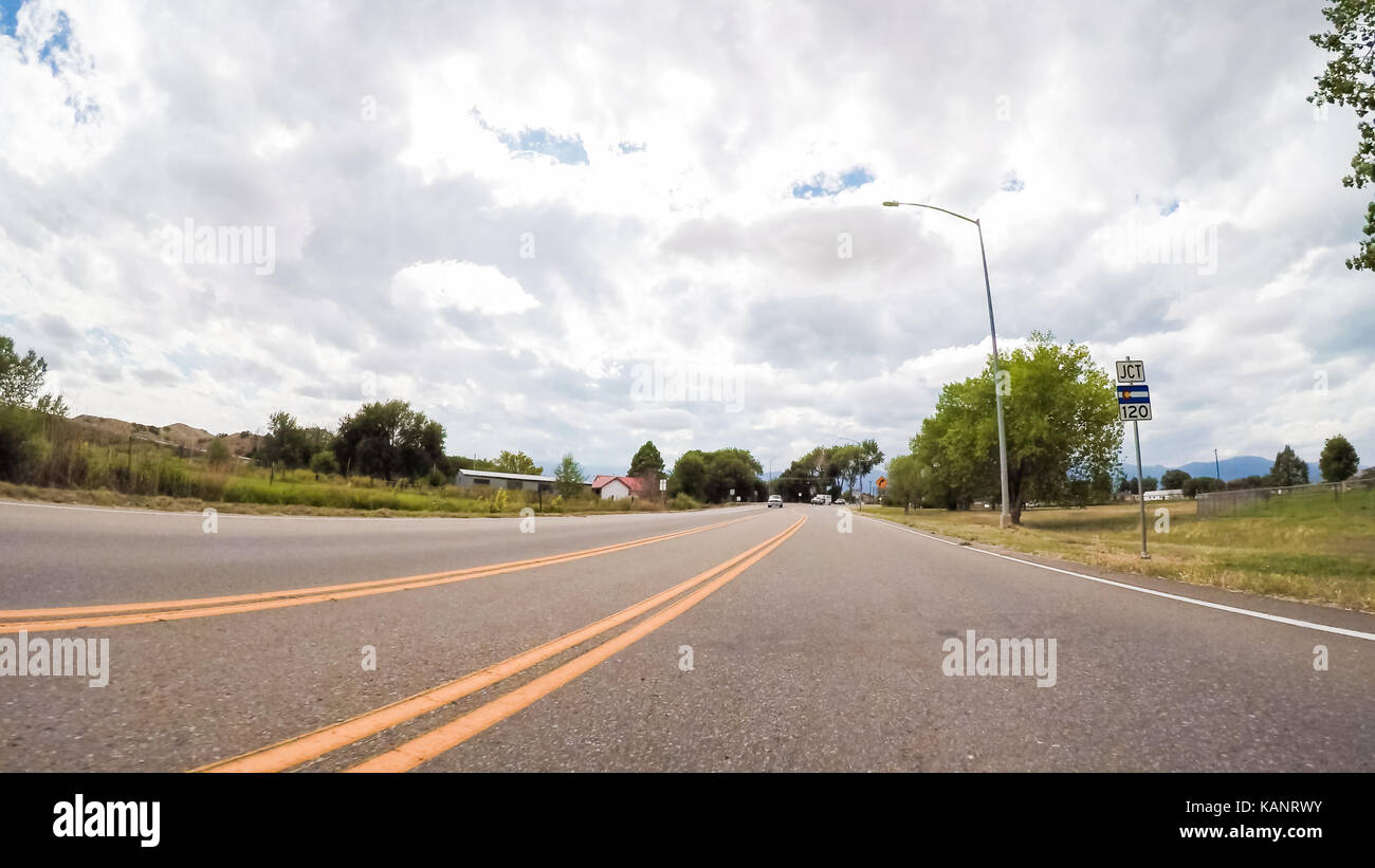 Driving in rural area of Western Colorado on cloudy day Stock Photo - Alamy