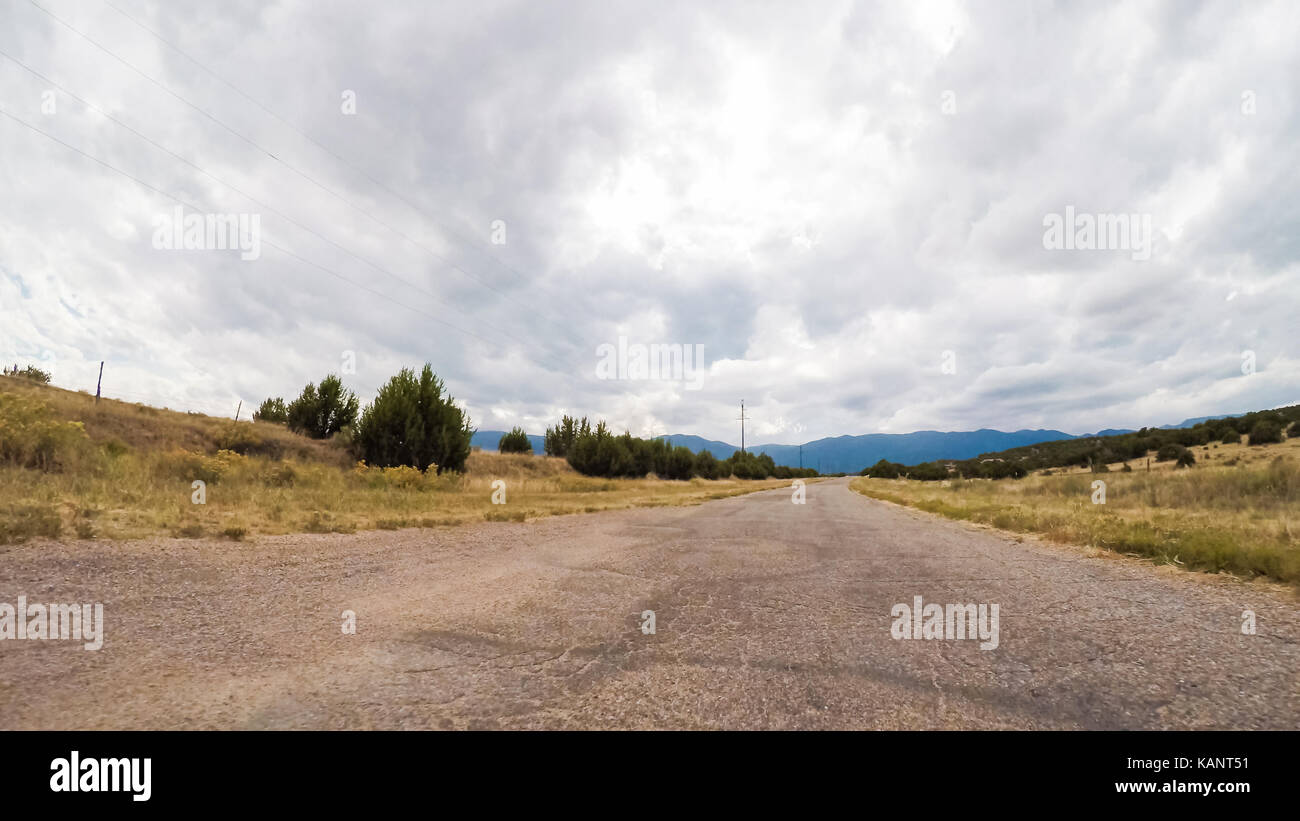 Driving in rural area of Western Colorado on cloudy day Stock Photo - Alamy