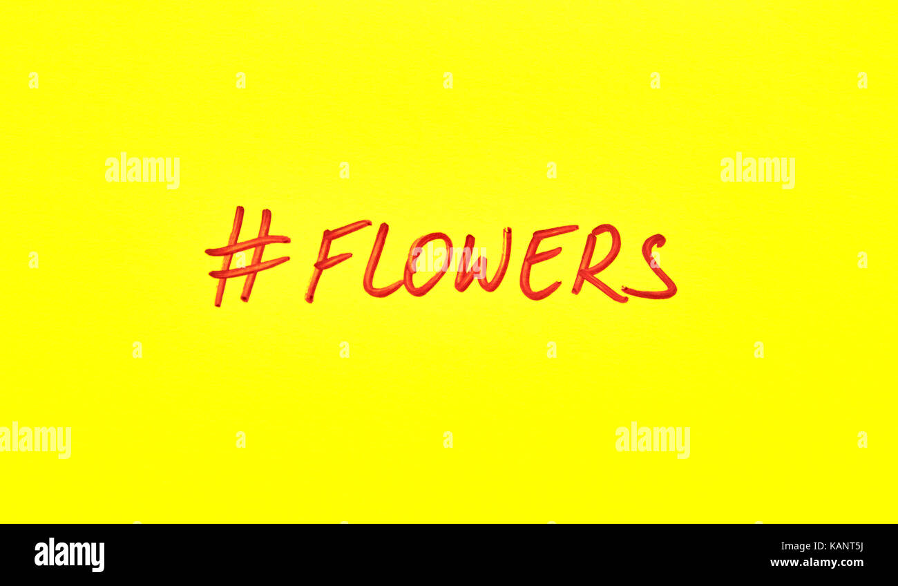 Popular hashtag flowers written on a yellow paper Stock Photo - Alamy