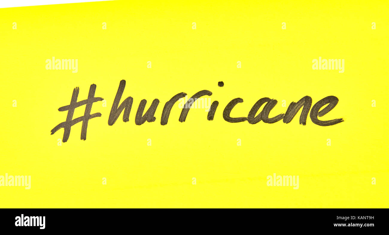 Popular hashtag hurricane written on a yellow paper Stock Photo - Alamy