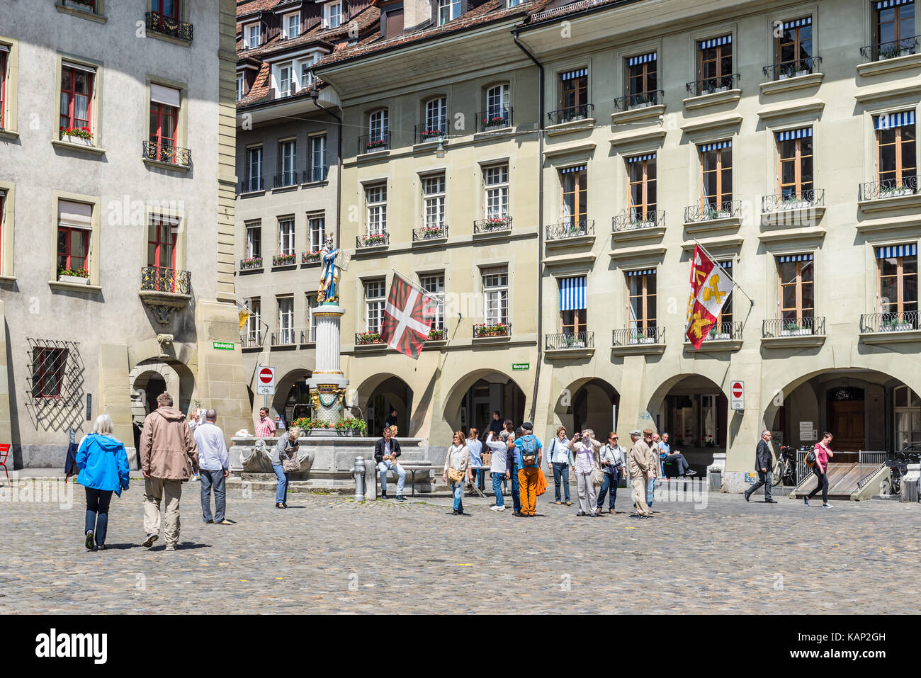 Bern, Switzerland - May 26, 2016: People on Munsterplatz square in the ...