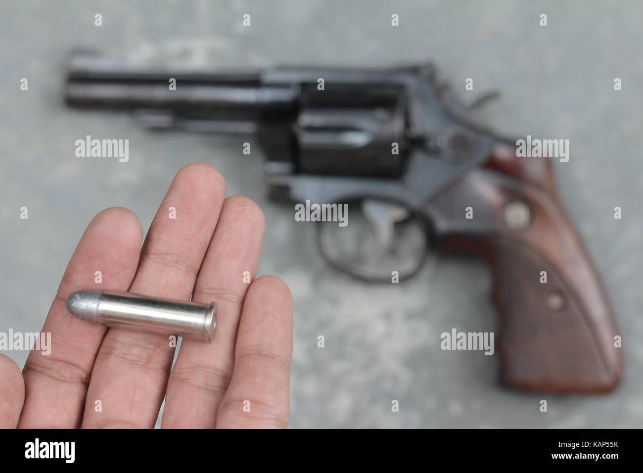 bullet and gun revolver Stock Photo - Alamy