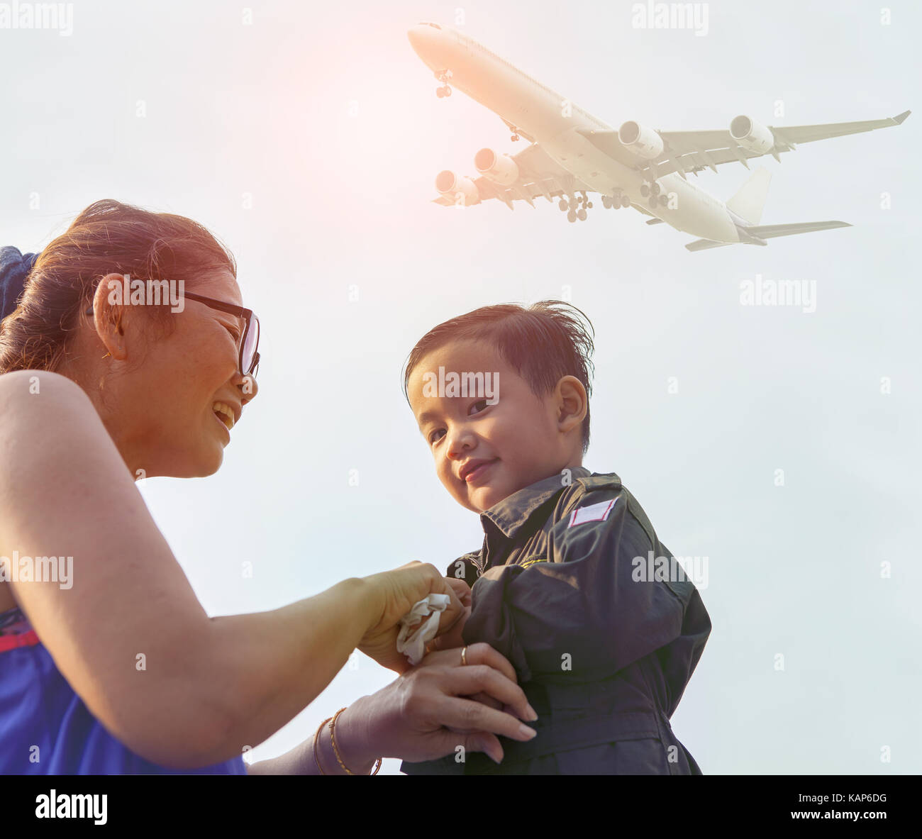 mother and boy dreaming to be a plane pilot Stock Photo - Alamy