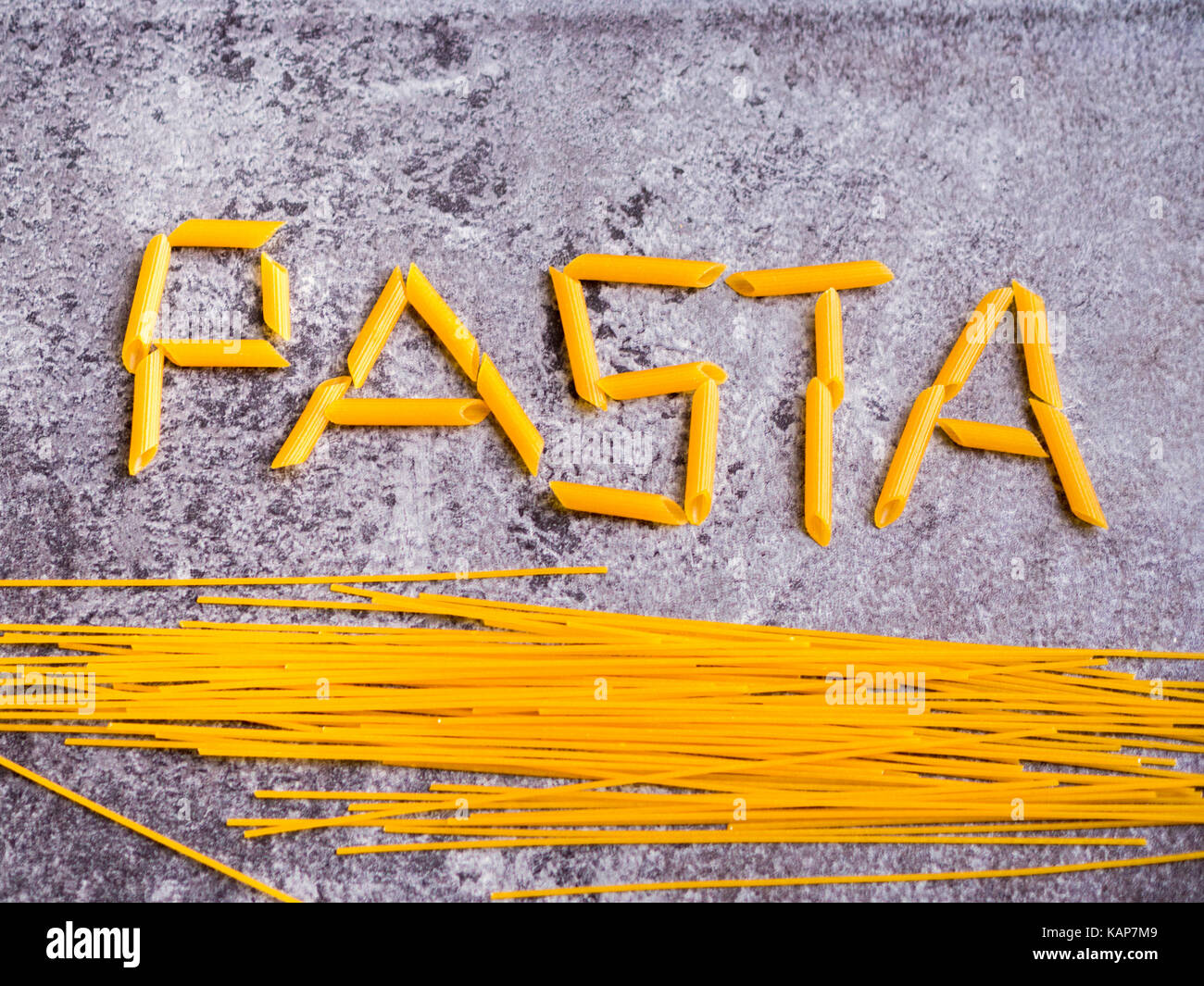 pasta word on black marble background Stock Photo - Alamy