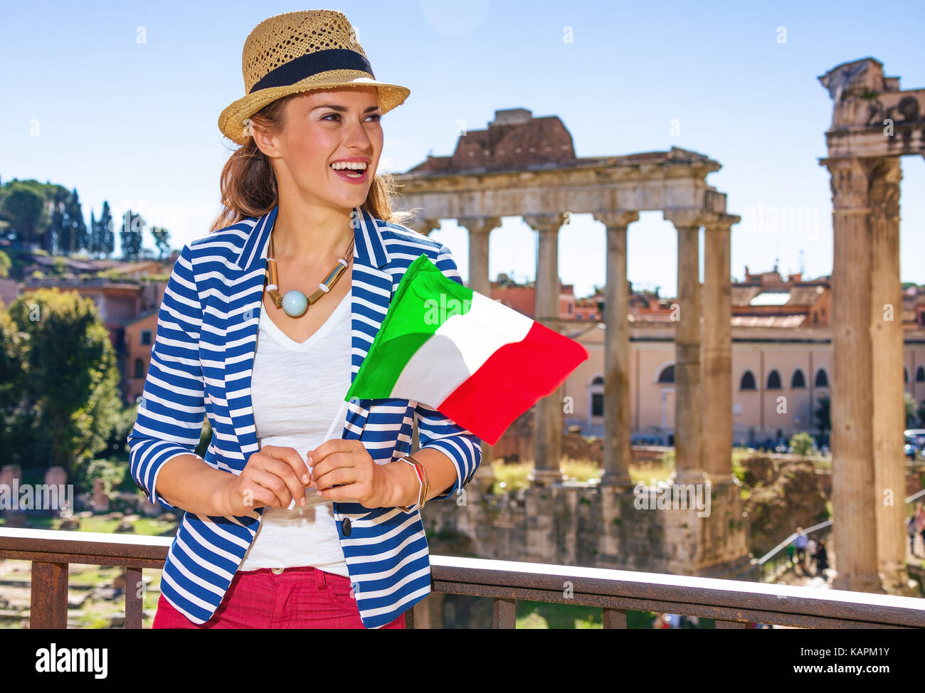 Roman Holiday. smiling modern woman in Rome, Italy with Italian flag ...