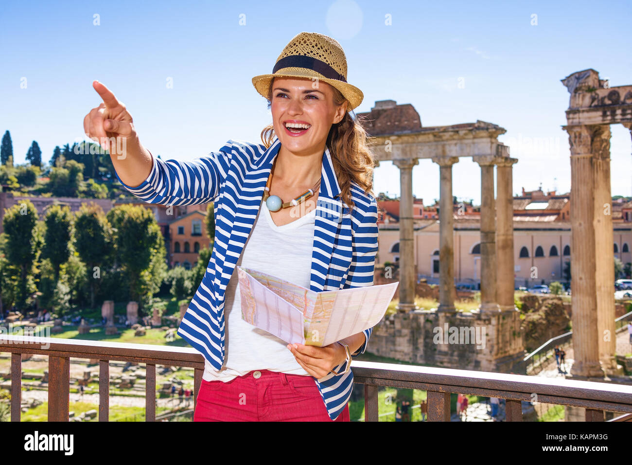 Roman Holiday. smiling modern woman in Rome, Italy holding map and ...