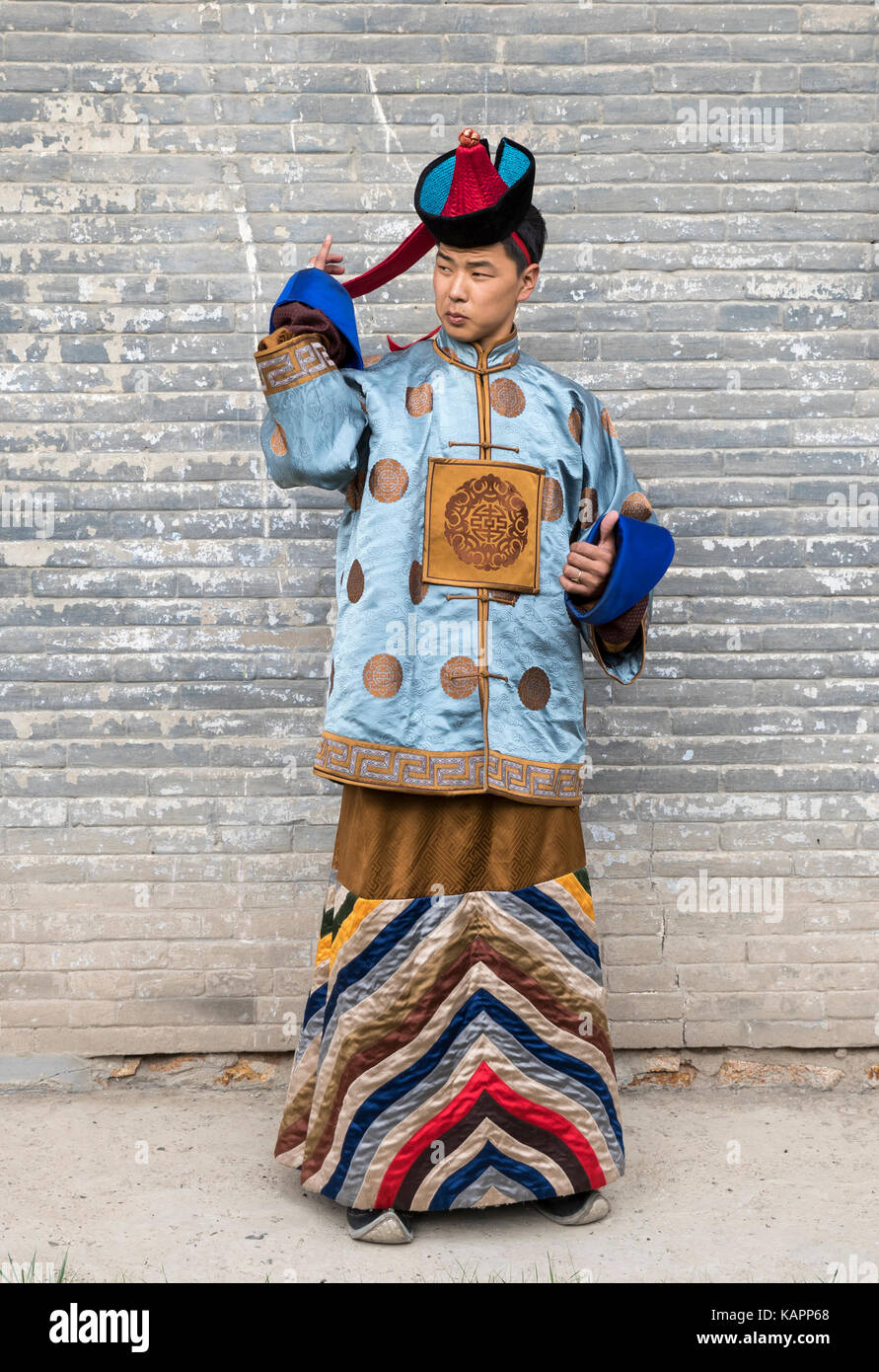 Mongolian man in traditional outfit near old Temple in Ulaanbaatar ...
