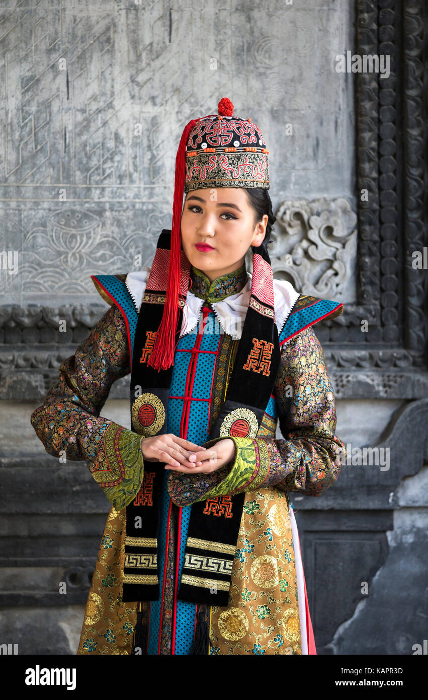 mongolian man in traditional outfit near old Temple in Ulaanbaatar ...