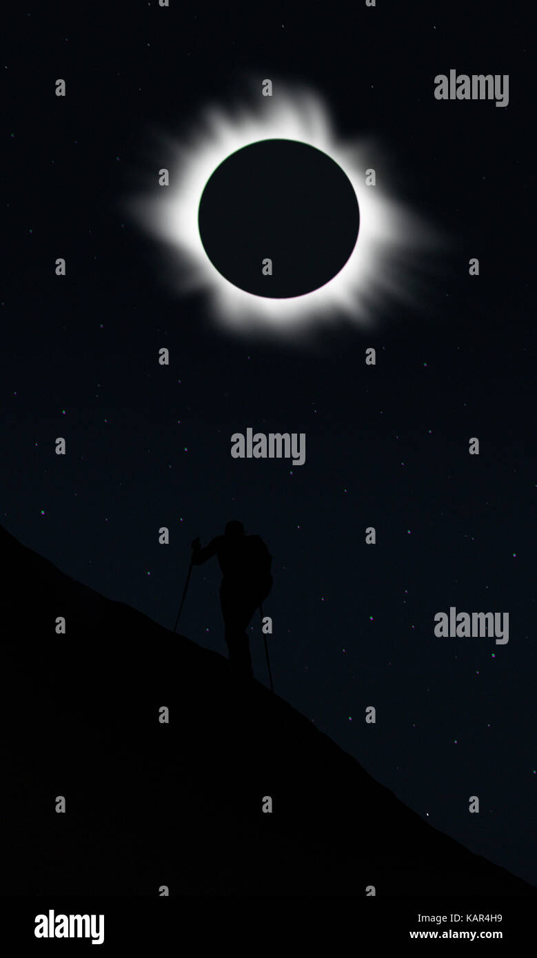 Man watching total eclipse during hiking Stock Photo - Alamy
