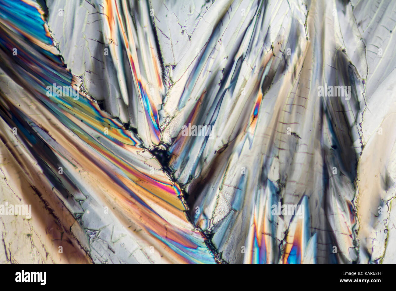 colorful microscopic shot of sugar micro crystals in polarized light ...