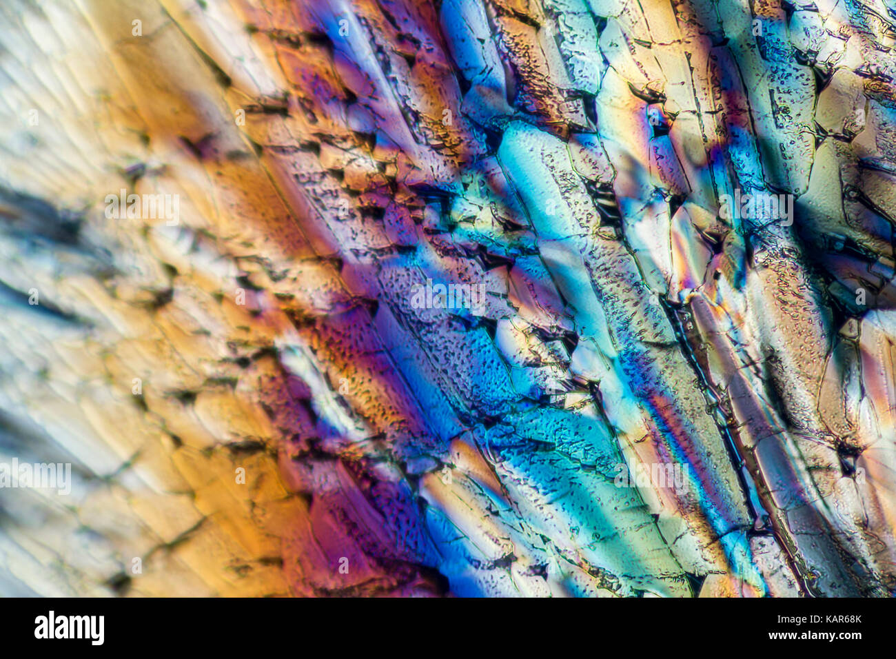 colorful microscopic shot of sugar micro crystals in polarized light ...