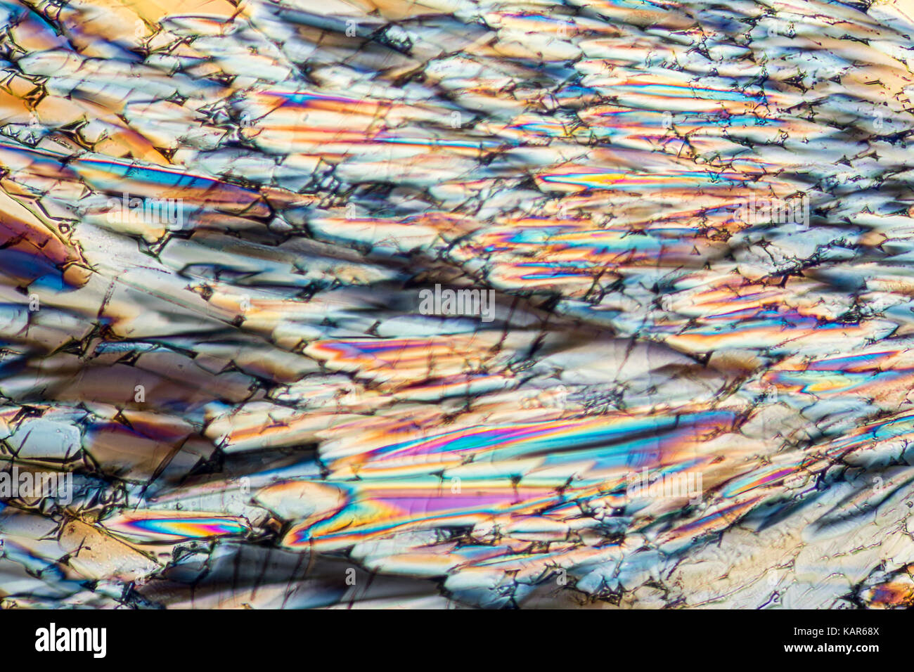 colorful microscopic shot of sugar micro crystals in polarized light ...