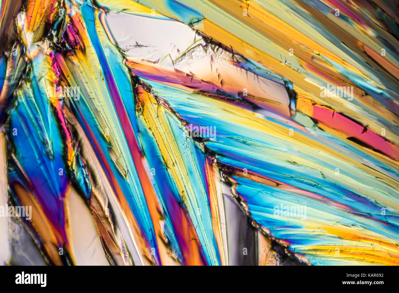 colorful microscopic shot of sugar micro crystals in polarized light ...