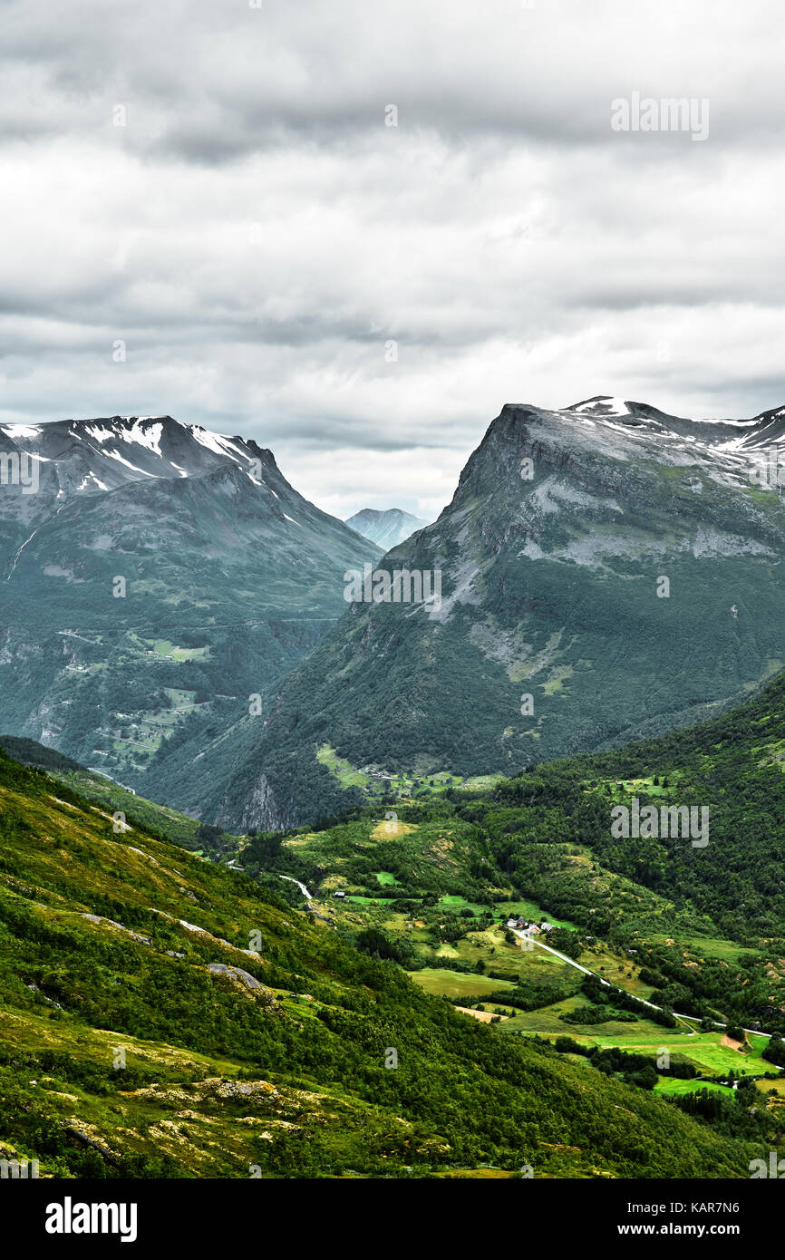 Close-up view of the mountains in western Norway with small villages ...