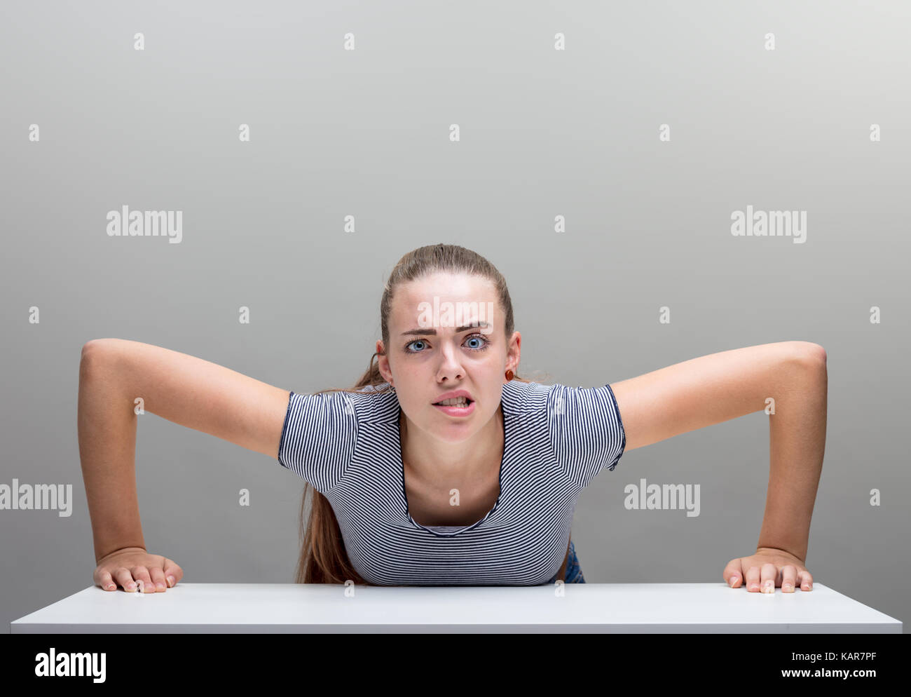 funny expression of an upset young woman, she could be angry and ready ...