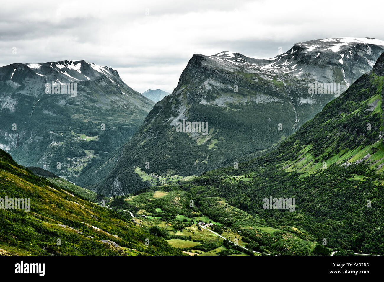 Close-up view of the mountains in western Norway with small villages ...