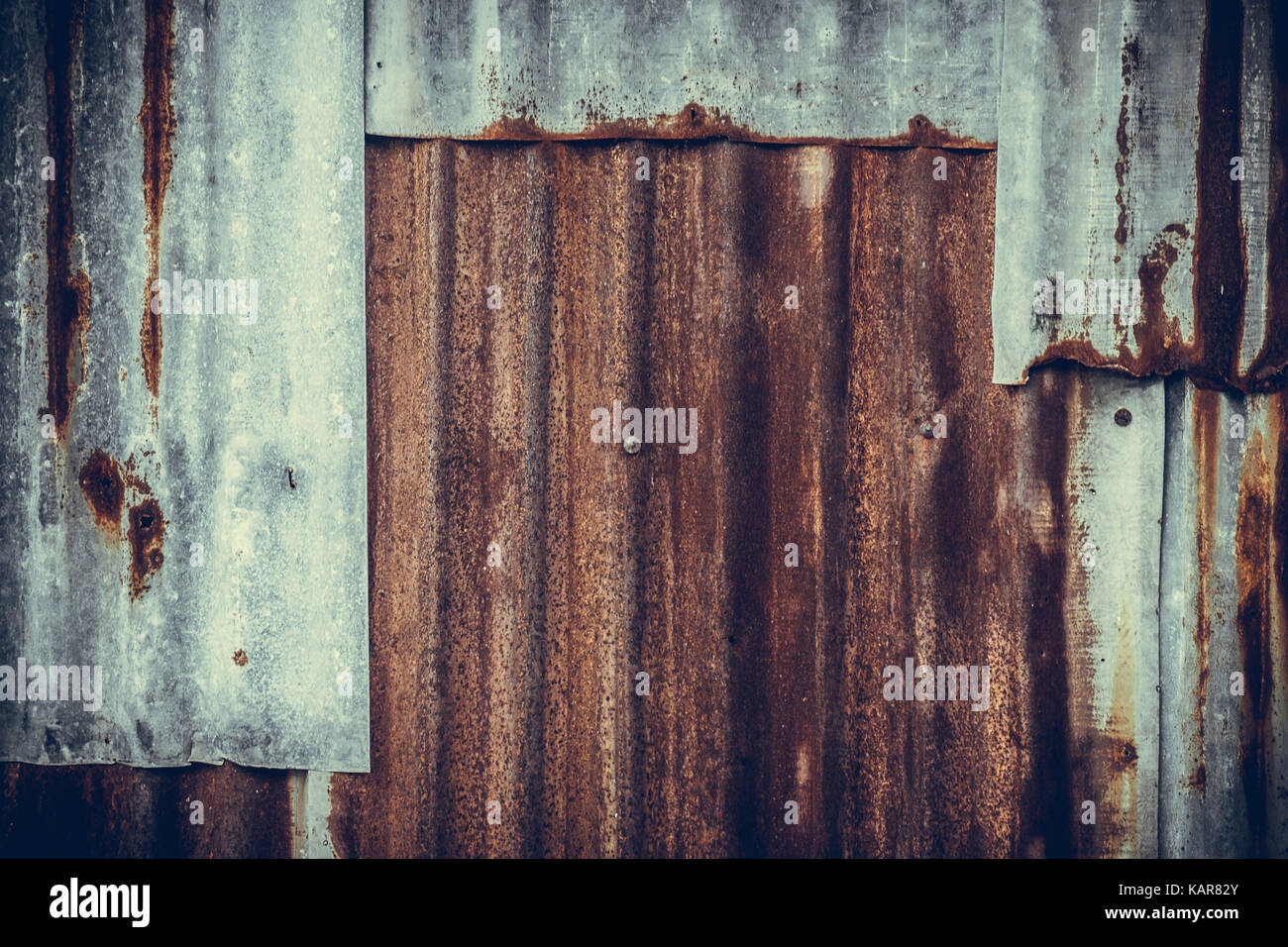Old rusty corrugated tin zinc metal wall in vintage tone with ...