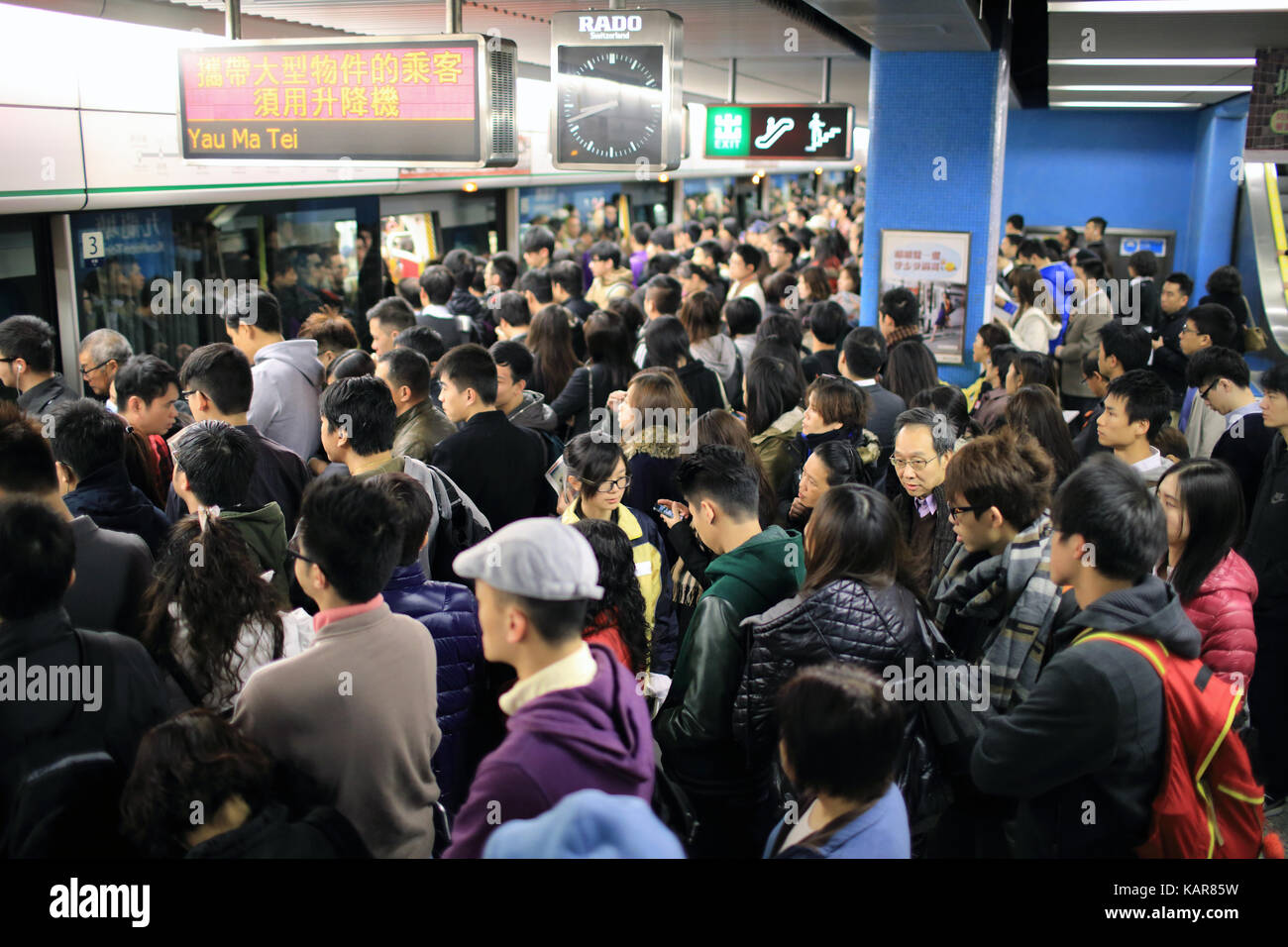 crowd of passengers are waiting in hong kong Stock Photo - Alamy