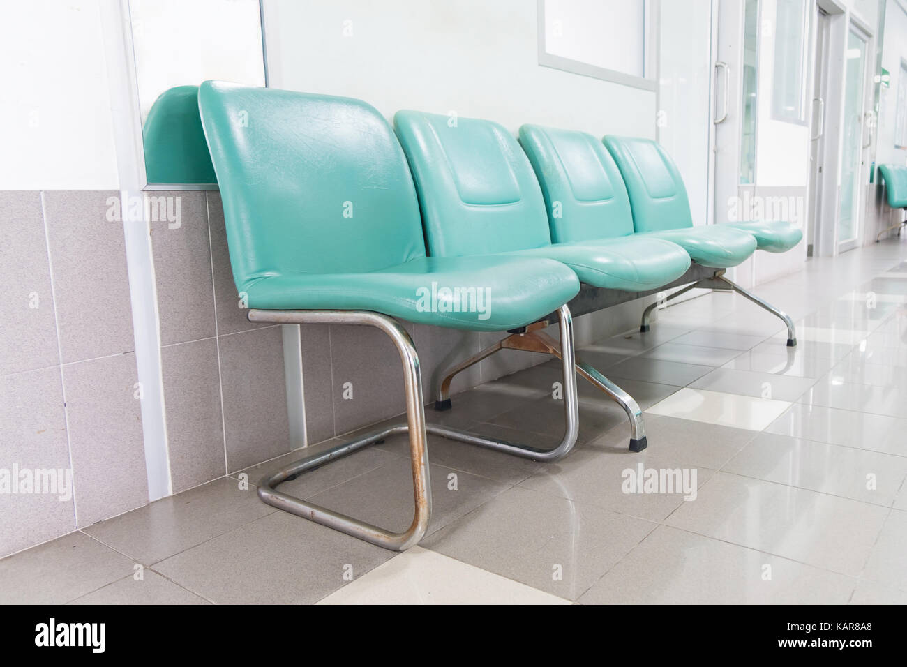 Empty green waiting chair in the hospital hallway. interior of clean ...