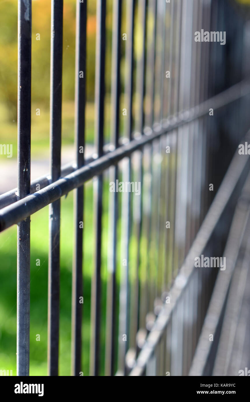 Close up of iron fence. Focus on foreground, vertical image Stock Photo ...