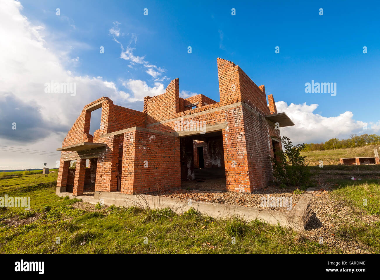 Exterior of an old building under construction. Orange brick walls in a ...