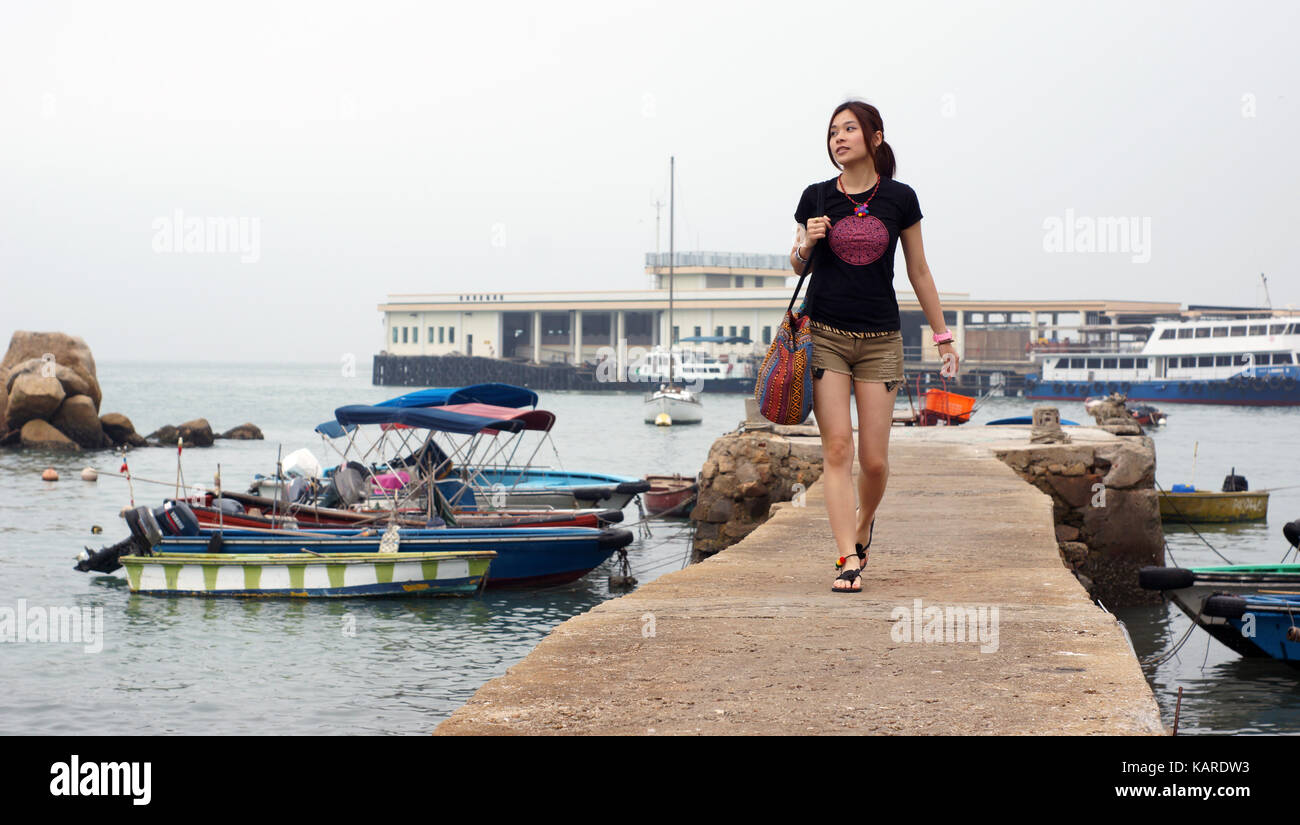 harbor girl walking Stock Photo - Alamy