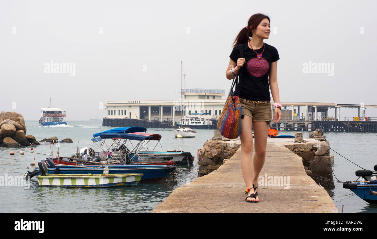harbor girl walking Stock Photo - Alamy