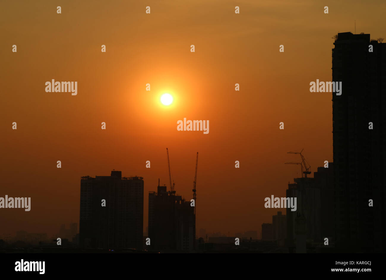 Beautiful sunset over the constructing buildings, Bangkok, Thailand ...
