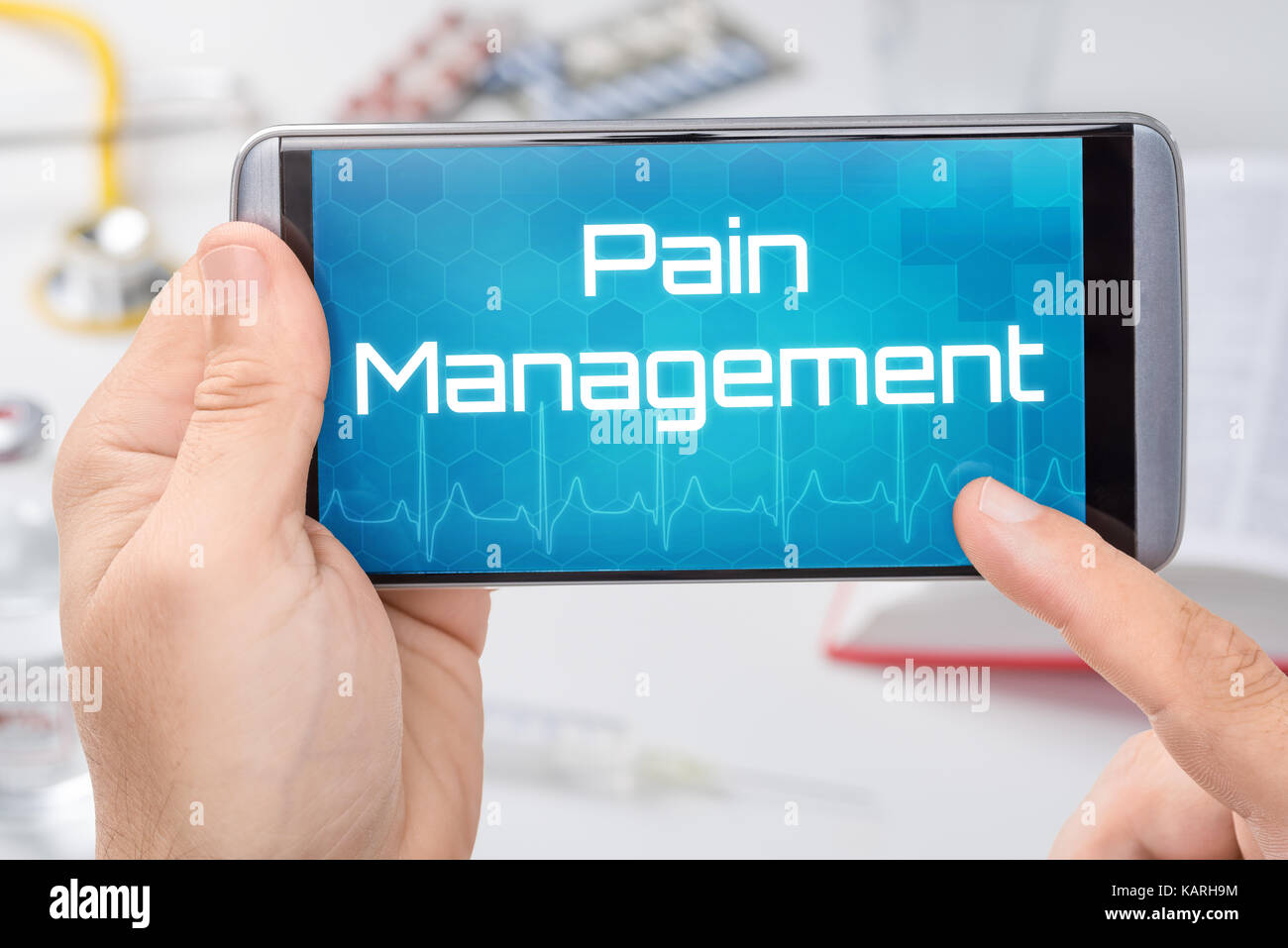 Smartphone with the text Pain Management on the display Stock Photo - Alamy