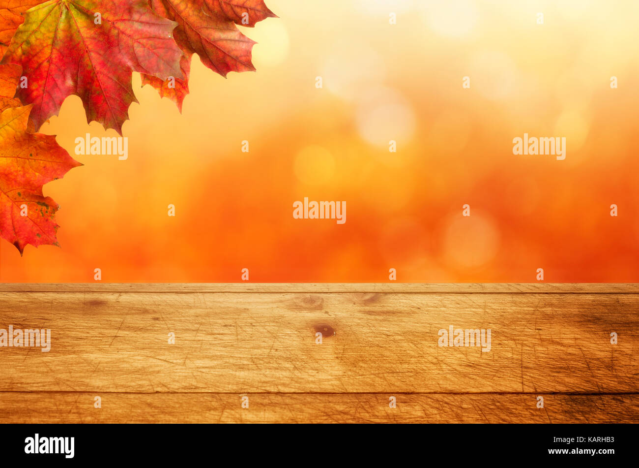 Rustic wooden table with an autumnal background Stock Photo - Alamy