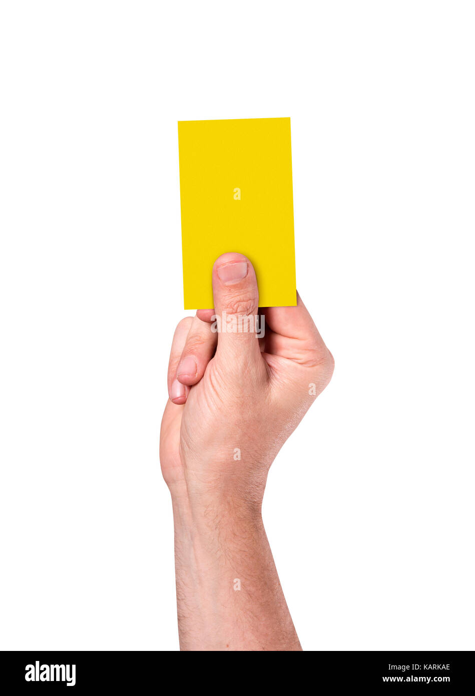 A male sports referee or umpire hand holding a yellow card up in the ...
